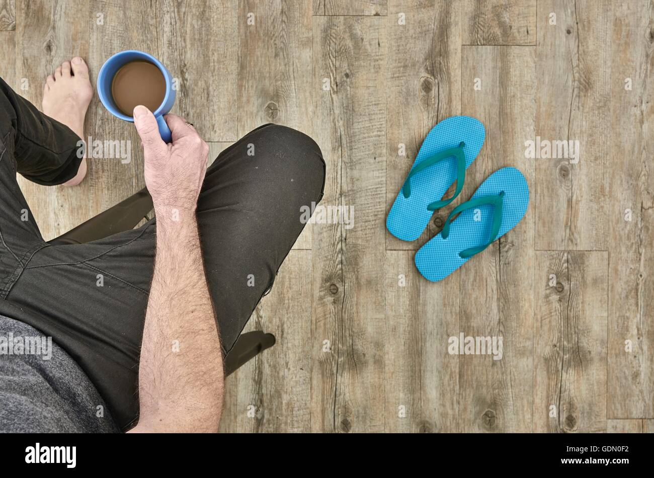 A studio photo of a person sitting on a stool Stock Photo - Alamy