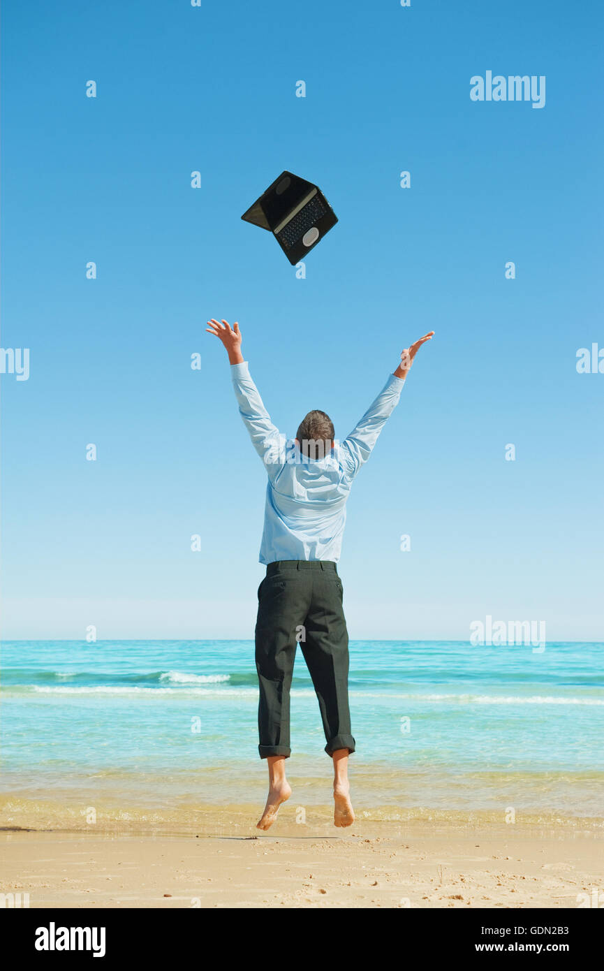 Businessman on the beach.Dreams come true. First day of vacation Stock ...