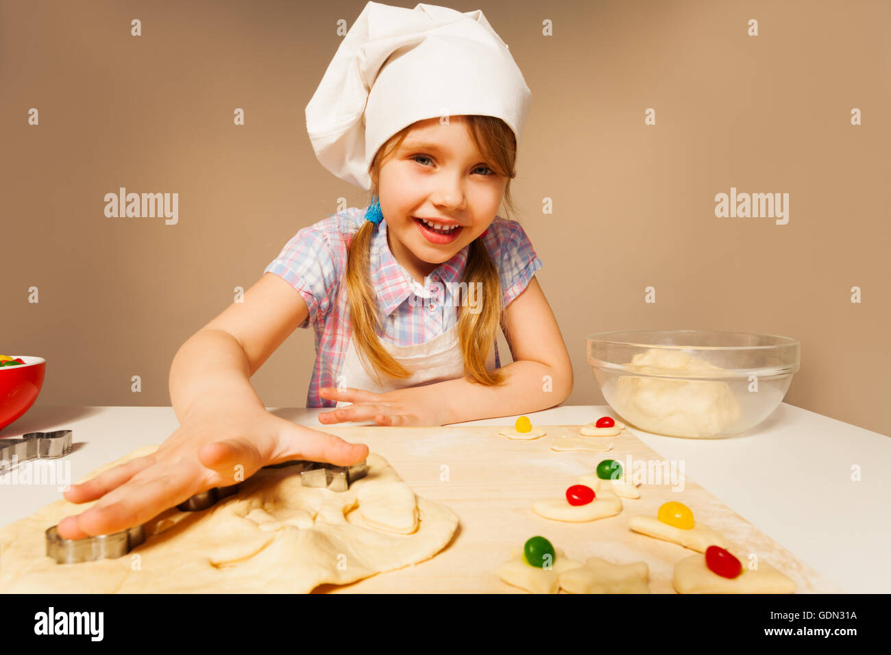 Cute girl playing baker making handmade cookies Stock Photo - Alamy