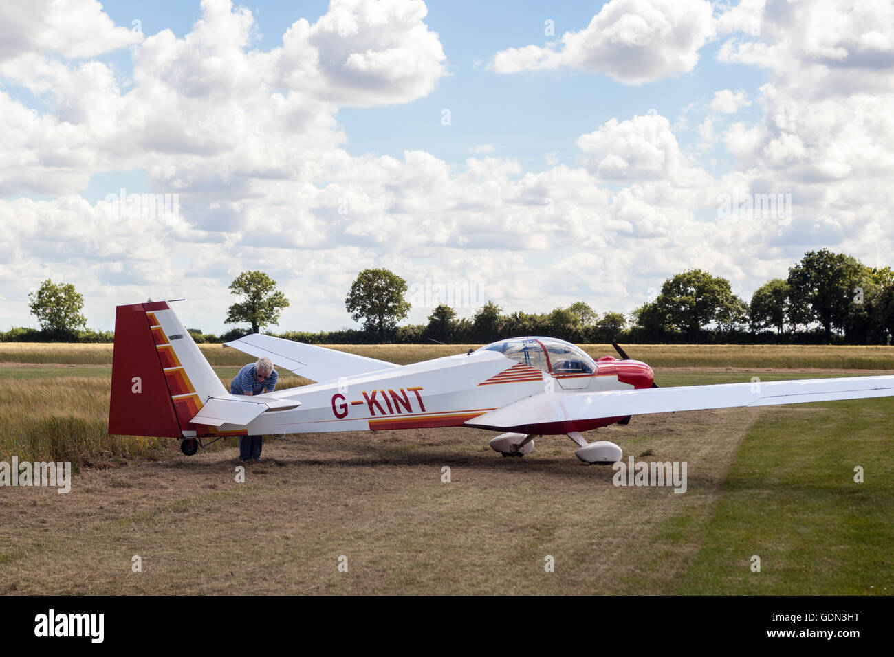 man lifting glider tail to turn it round Stock Photo - Alamy