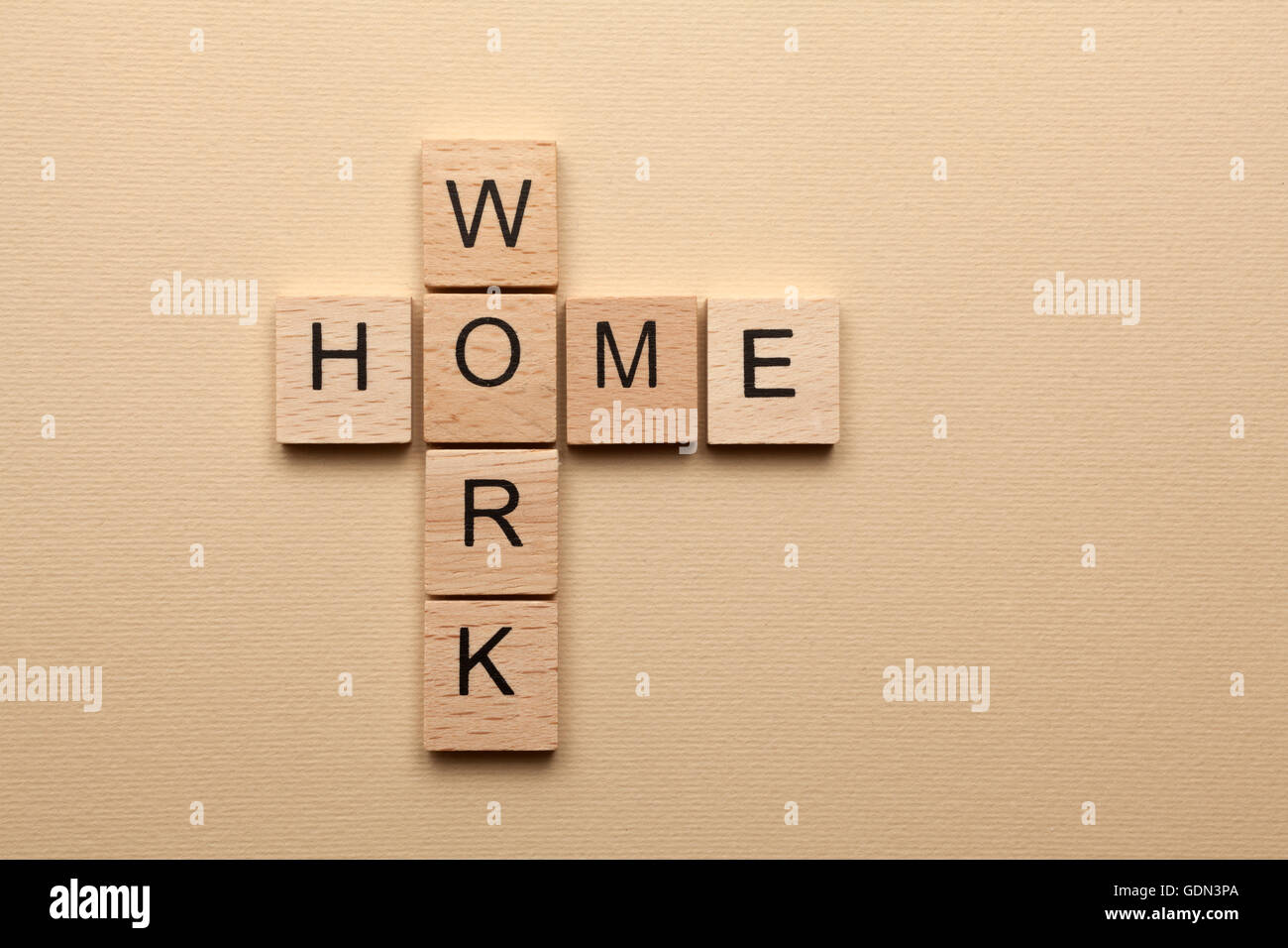 Wooden letters spelling WORK - HOME Stock Photo - Alamy