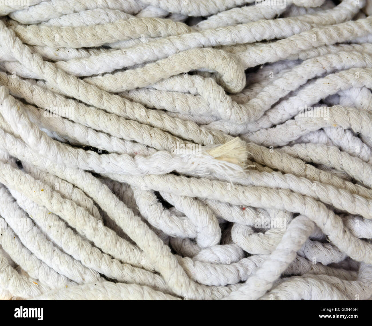 pattern and color in the form of tangled ropes beige Stock Photo - Alamy