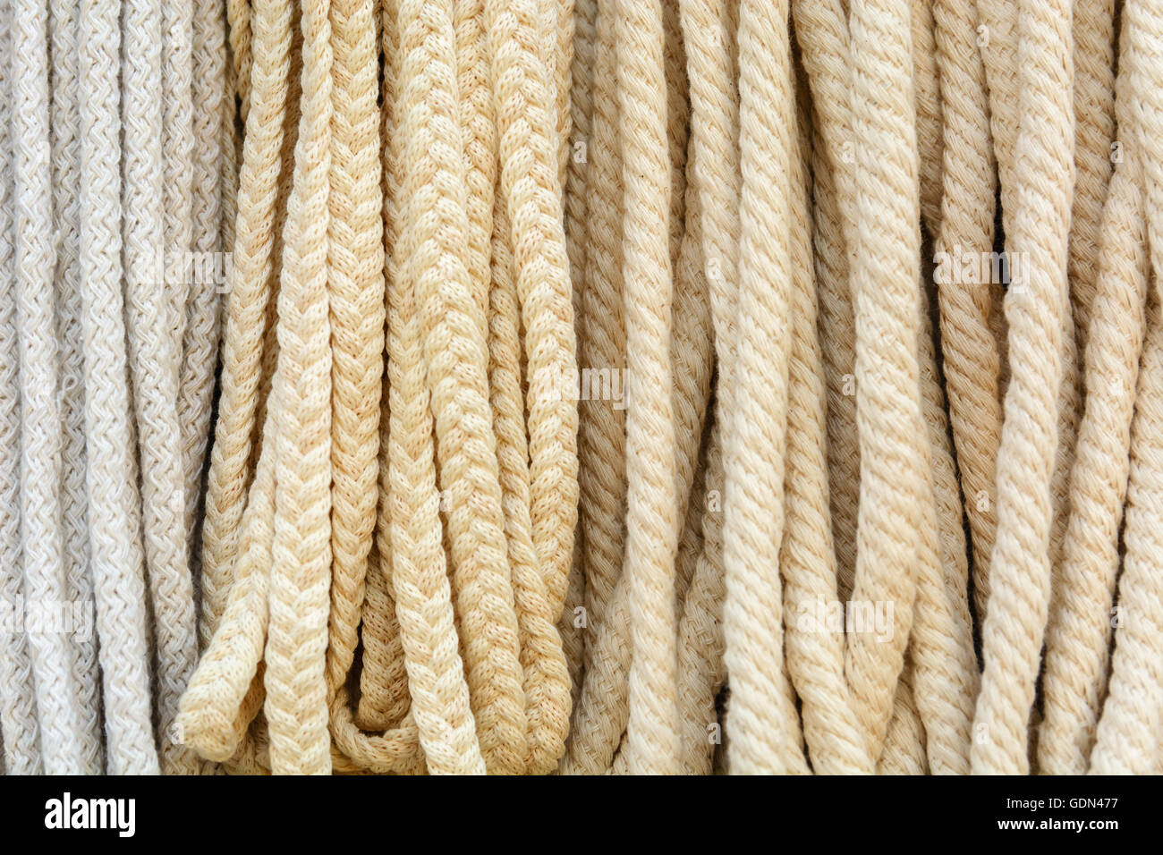pattern and color in the form of tangled ropes beige Stock Photo - Alamy