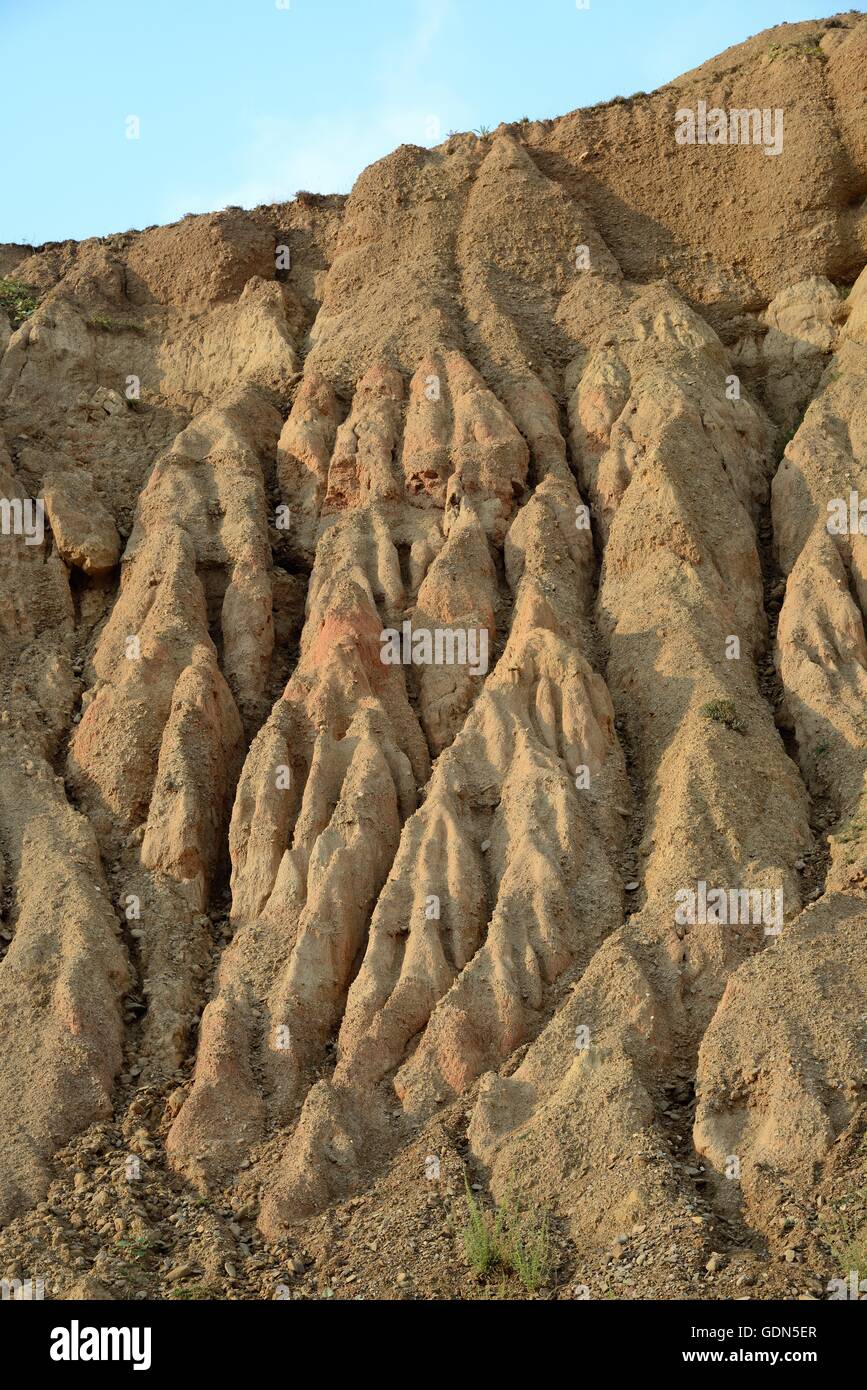 Heavily eroded, weathered soft sandstone / conglomerate cliffs, near ...
