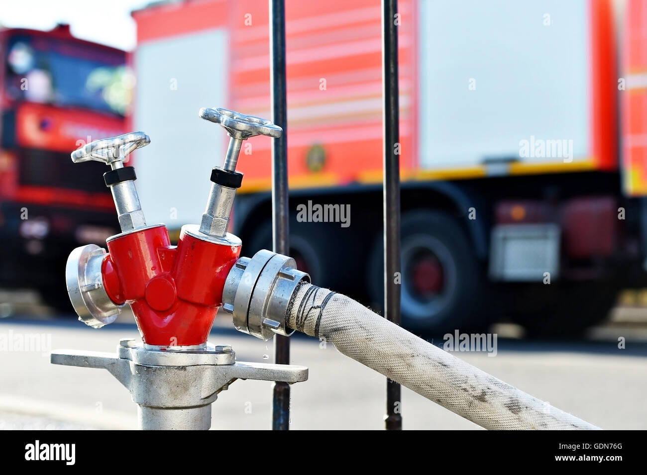 Water hose connected to hydrant during firefighting operation Stock ...
