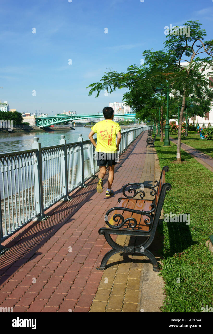 Young man running at riverside hi-res stock photography and images - Alamy