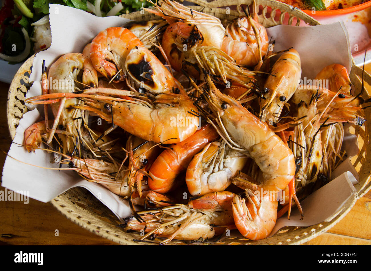 Shrimp and prawn grilled in basket for sale at restaurant Stock Photo ...