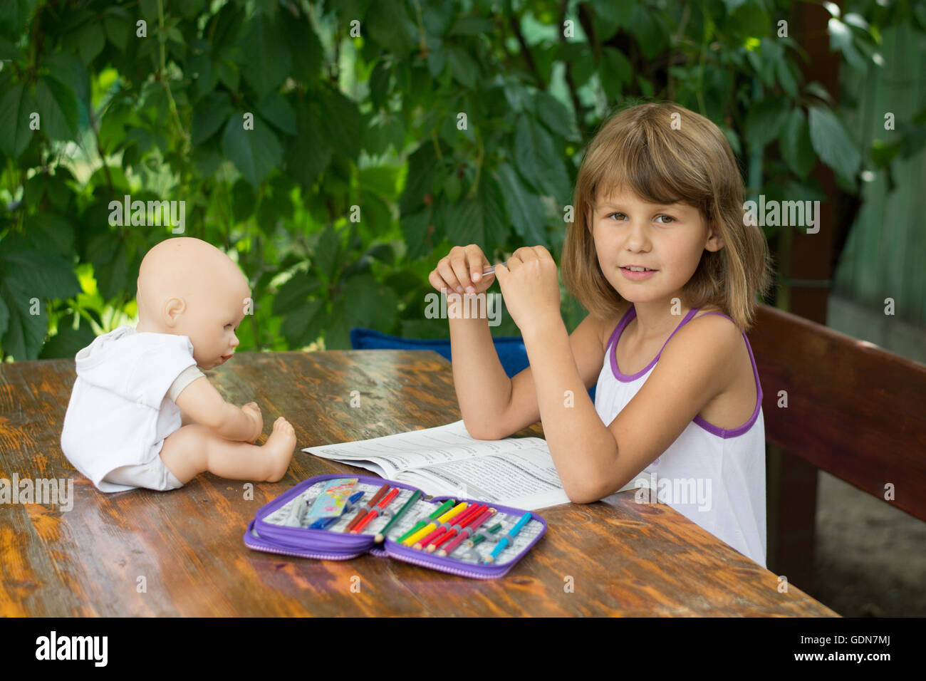 cute girl making lessons Stock Photo - Alamy
