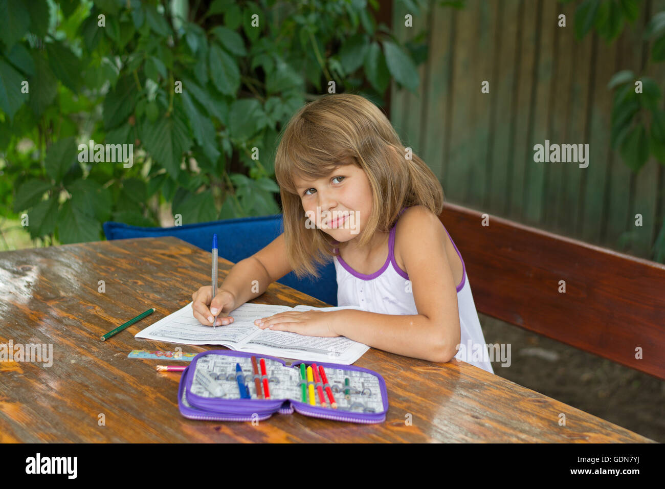 cute girl making lessons Stock Photo - Alamy