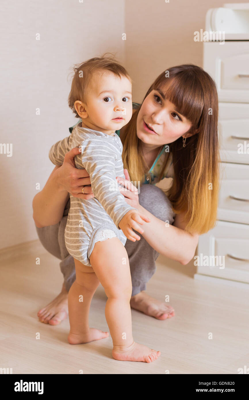 Portrait of happy mother and baby at home Stock Photo - Alamy