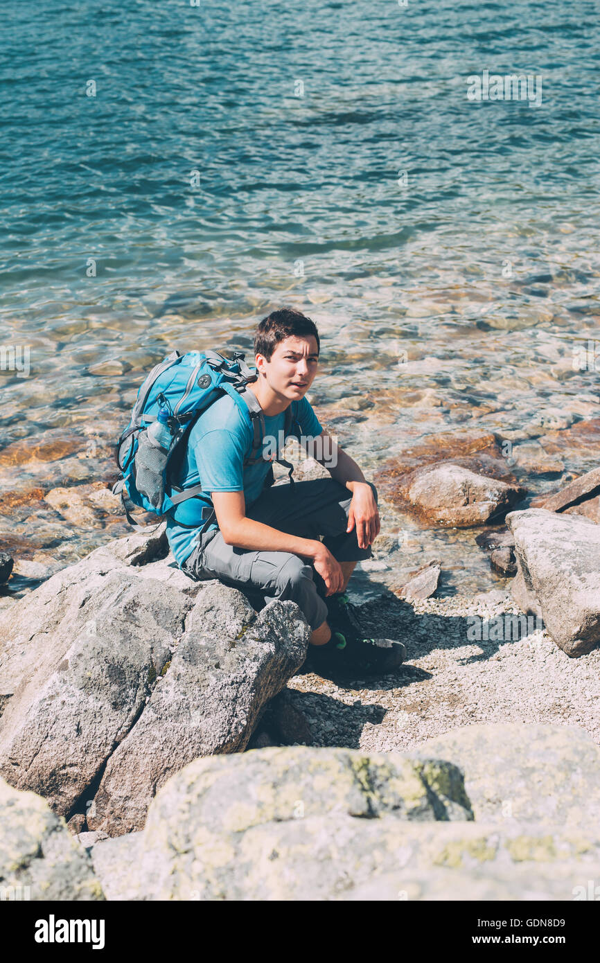 Teenager resting at the lake Stock Photo - Alamy
