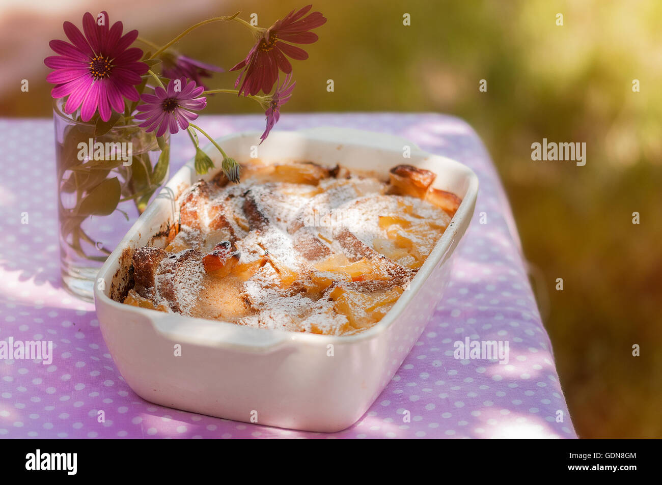 Bread pudding with fruits in a garden Stock Photo - Alamy