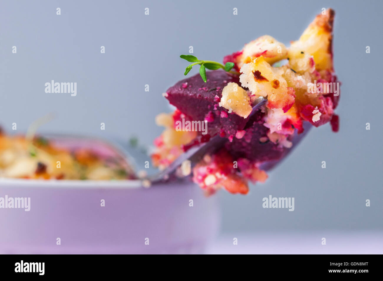 Beetroot crumble in a white ramekin Stock Photo - Alamy