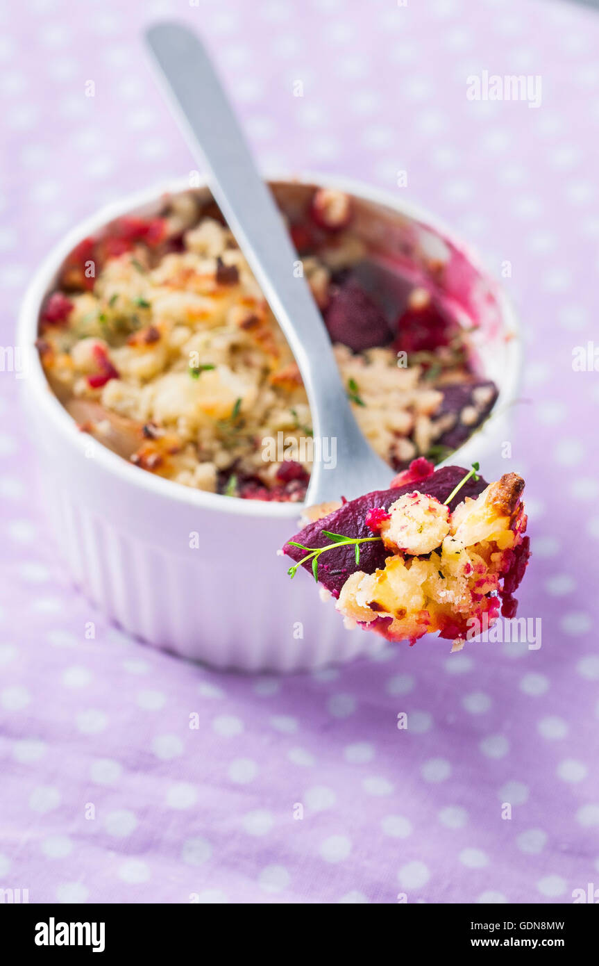 Beetroot crumble in a white ramekin Stock Photo - Alamy