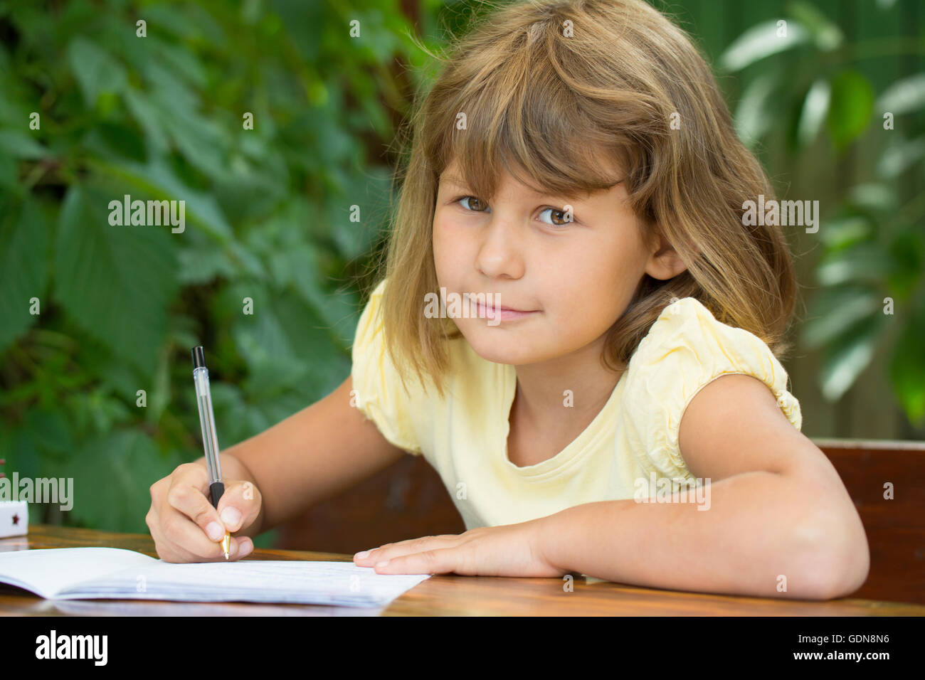 cute girl making lessons Stock Photo - Alamy