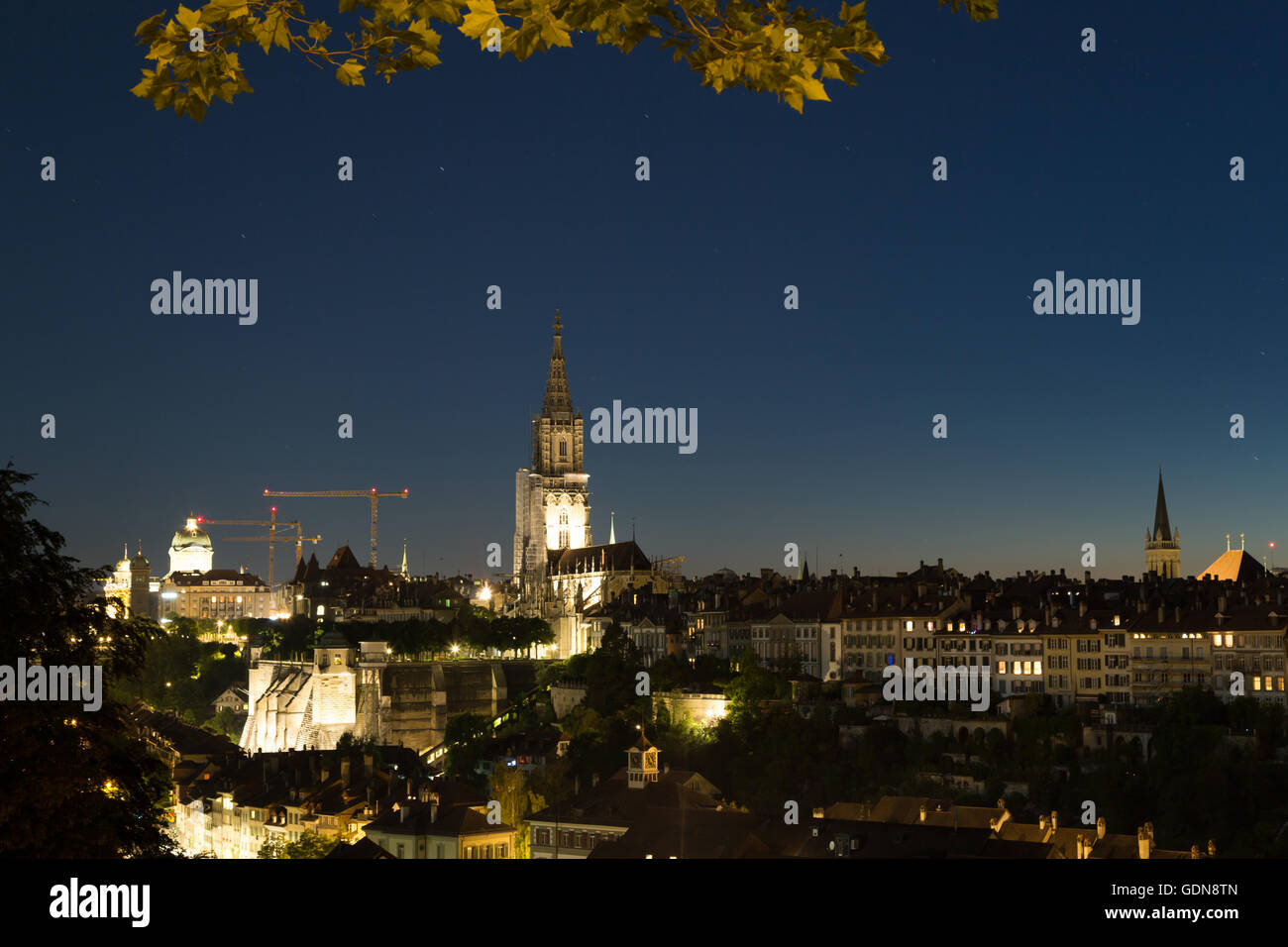 A photograph of the old city of Bern at night. Bern is one of ...