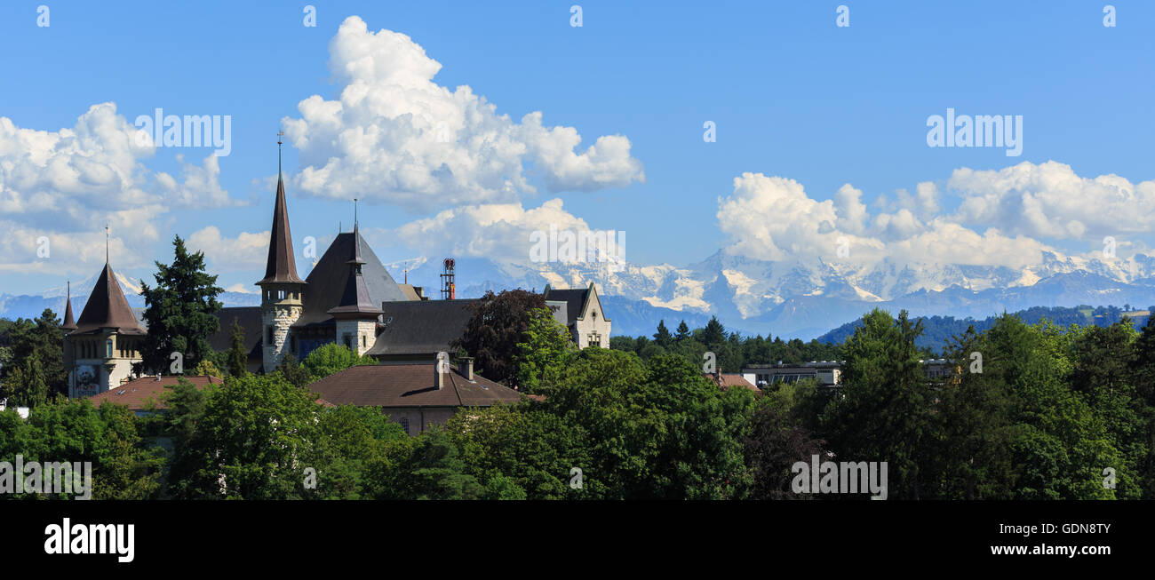 A photograph of the Bern Historical Museum and the Swiss Alps as seen ...