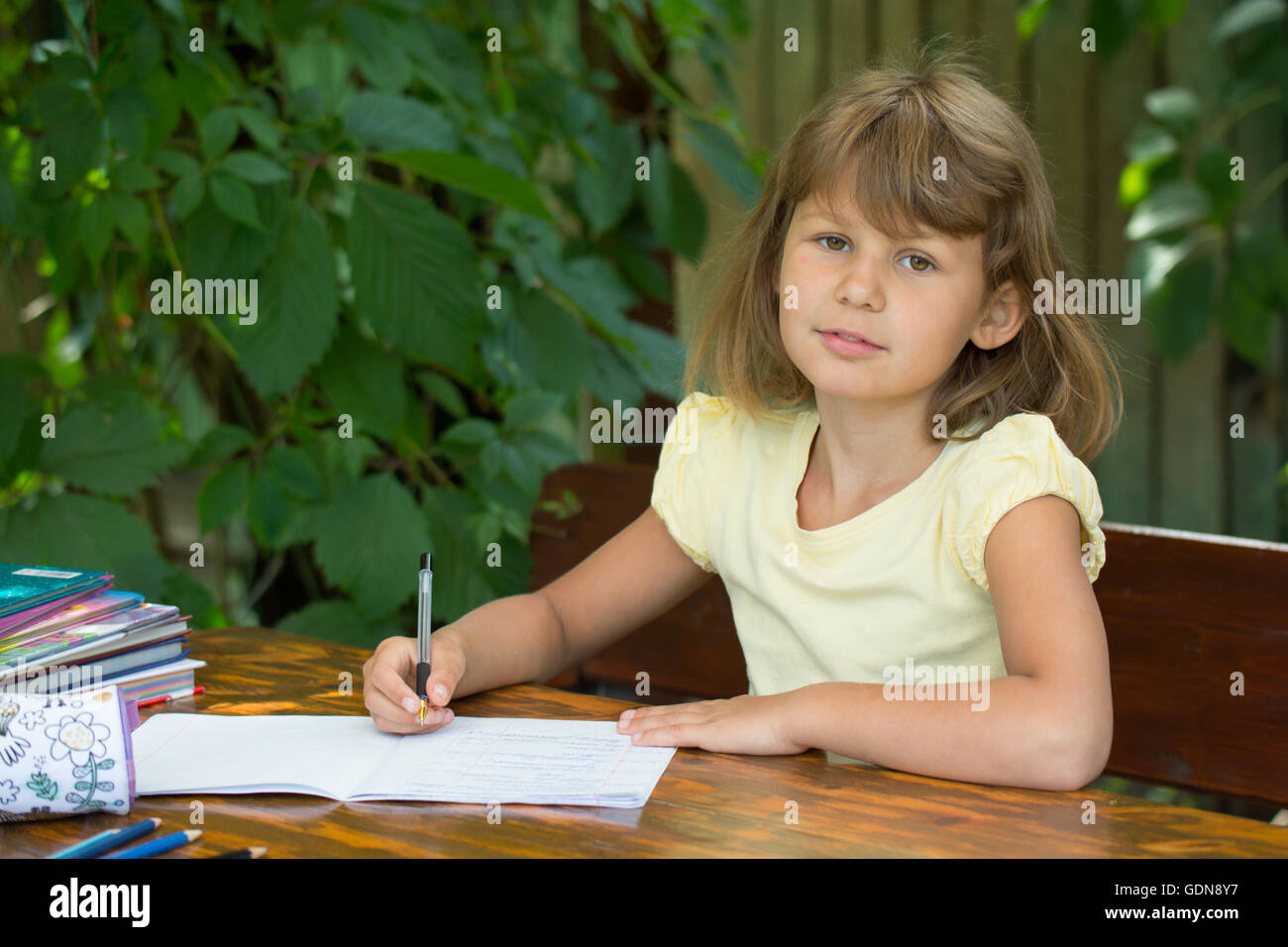 cute girl making lessons Stock Photo - Alamy