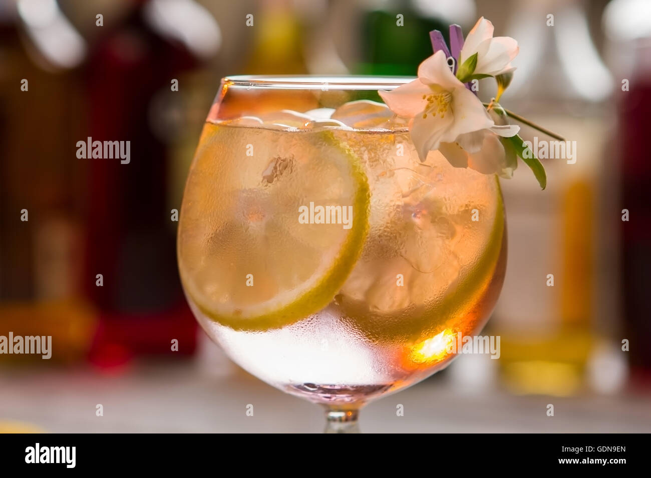Cocktail with lemon slice Stock Photo - Alamy
