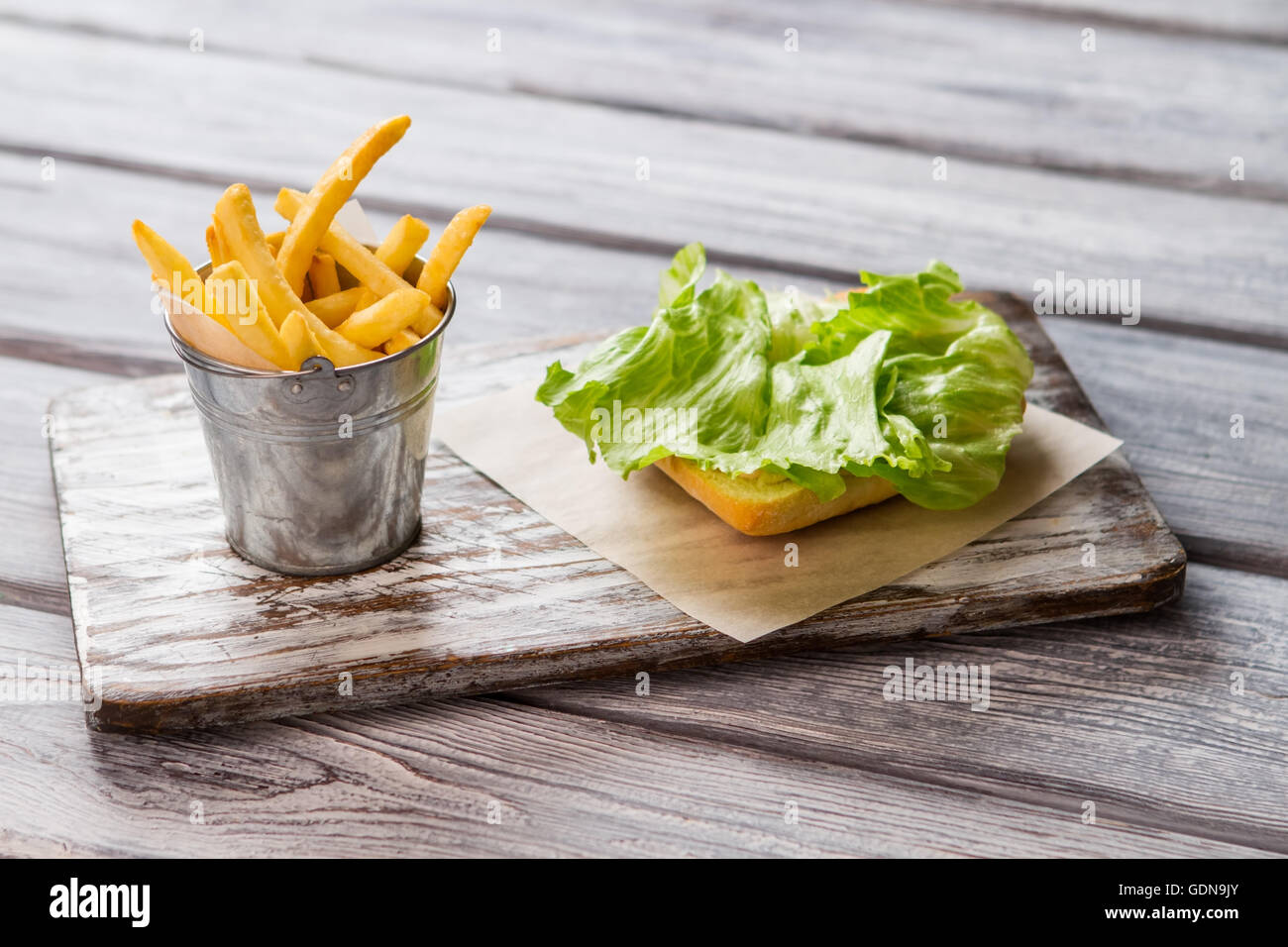 Bucket of fries and bread Stock Photo - Alamy