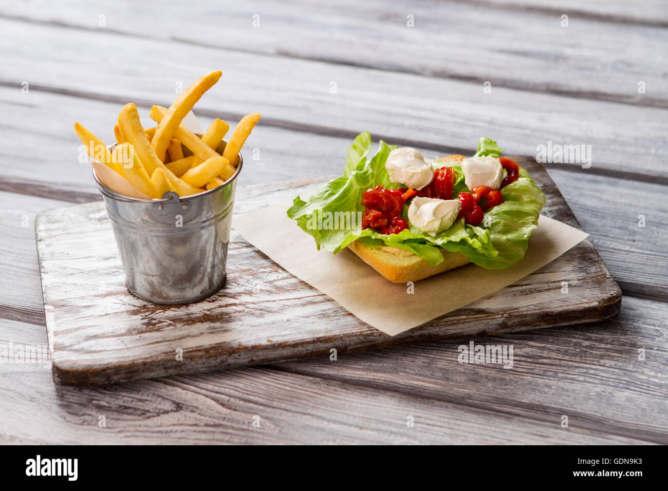 Bucket with fries and bread Stock Photo - Alamy