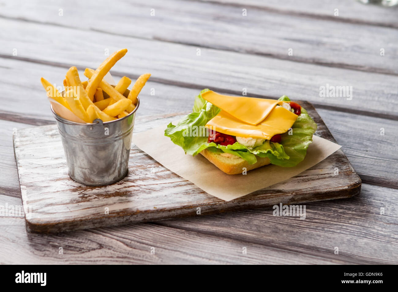 Small bucket of fries Stock Photo - Alamy