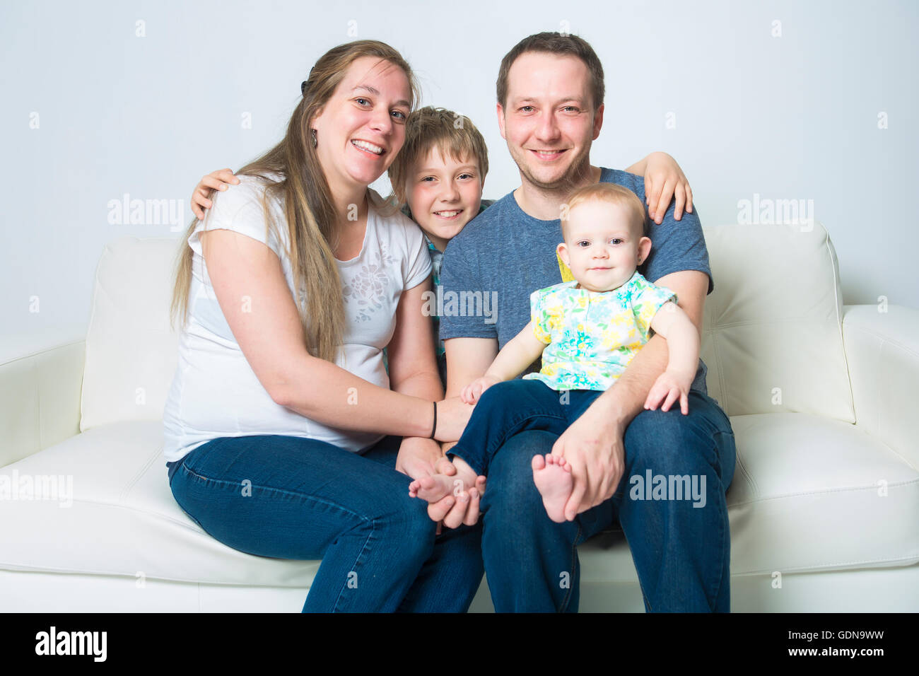 Young family with two kids Stock Photo - Alamy