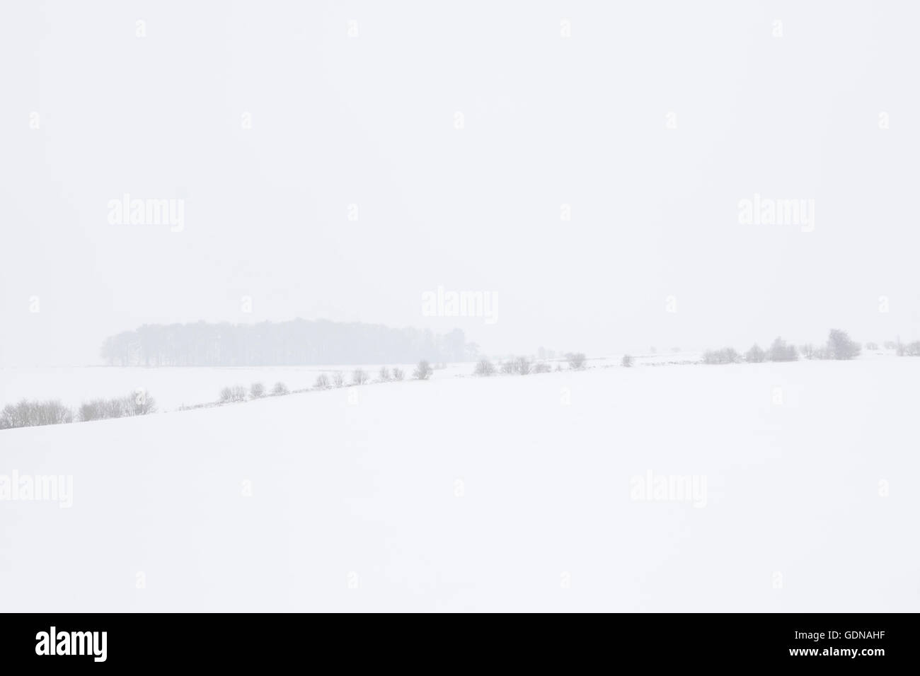 Fields covered in a layer of snow in this bleak winters landscape with ...