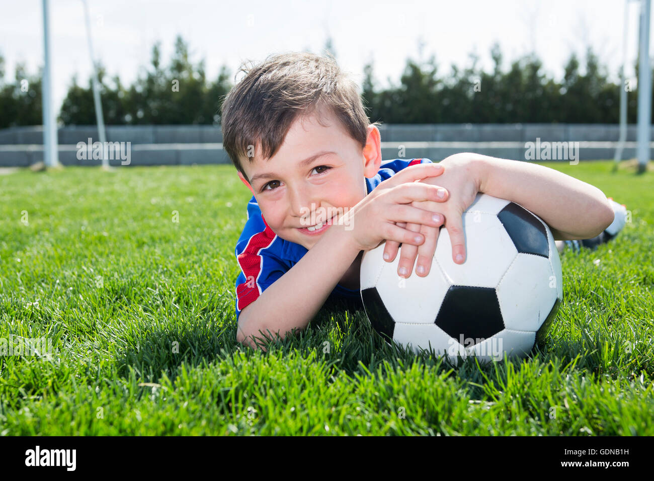Blond boy playing football soccer hi-res stock photography and images ...