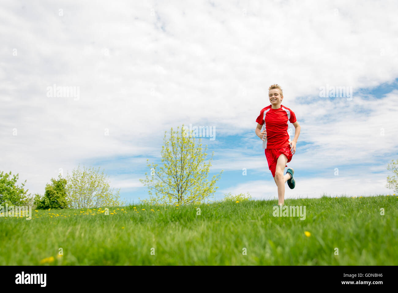 Teen boy running track hi-res stock photography and images - Alamy