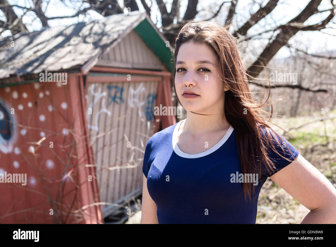 Girl by Old Barn Stock Photo - Alamy
