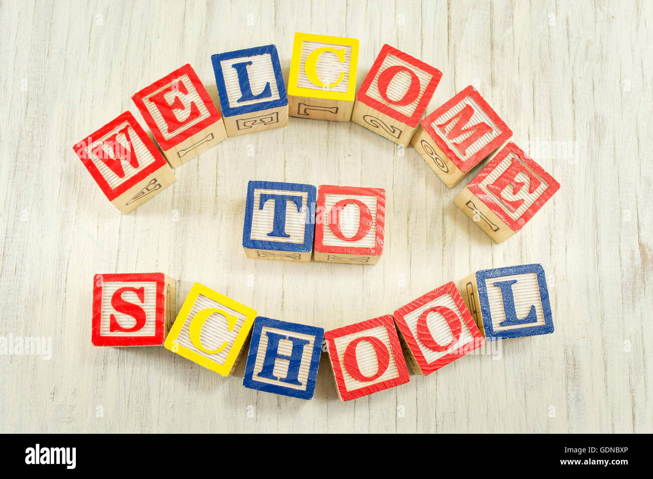 Welcome to school written with wooden cubicle letters Stock Photo - Alamy