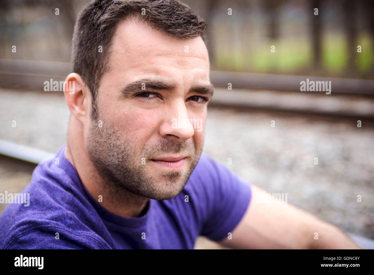nice young man portrait on the railroad Stock Photo - Alamy