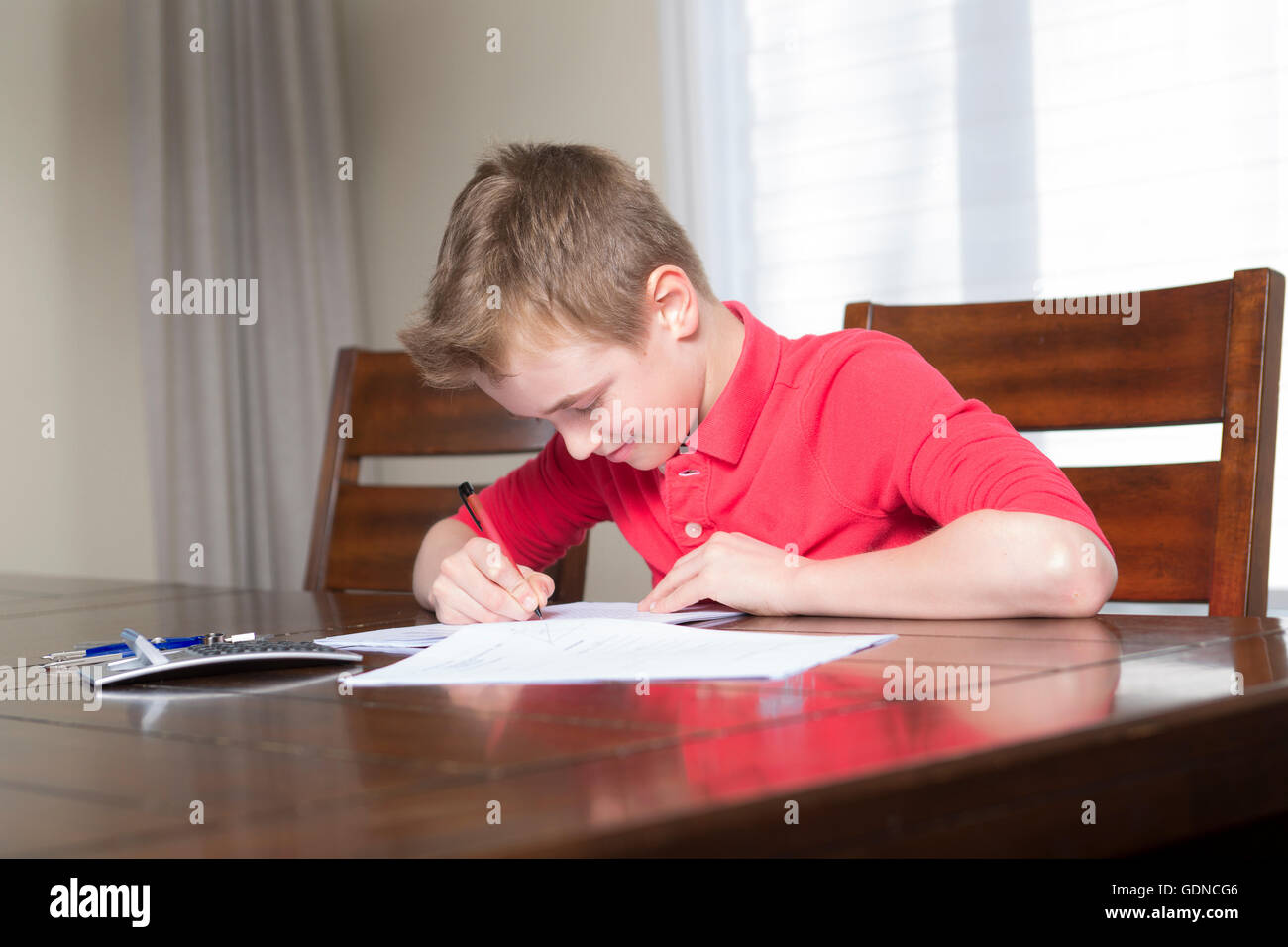 boy doing his homework at home Stock Photo - Alamy