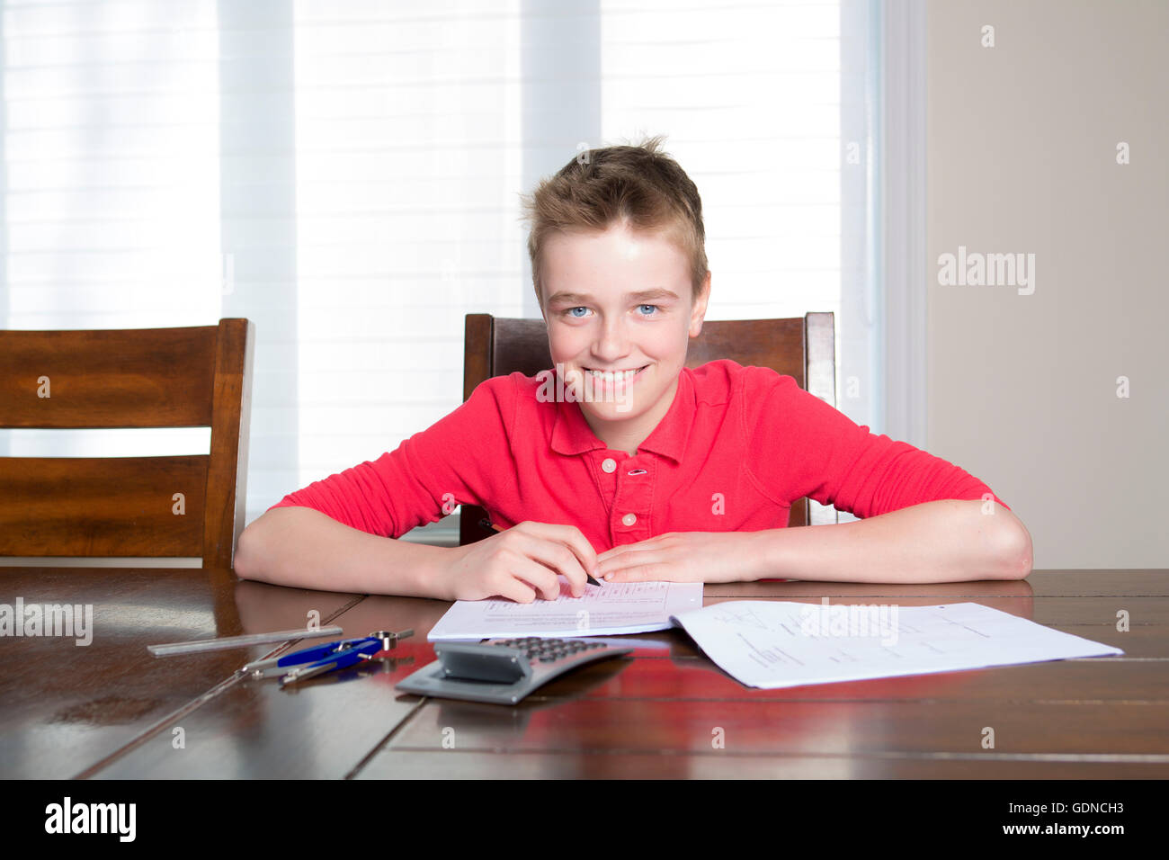 boy doing his homework at home Stock Photo - Alamy
