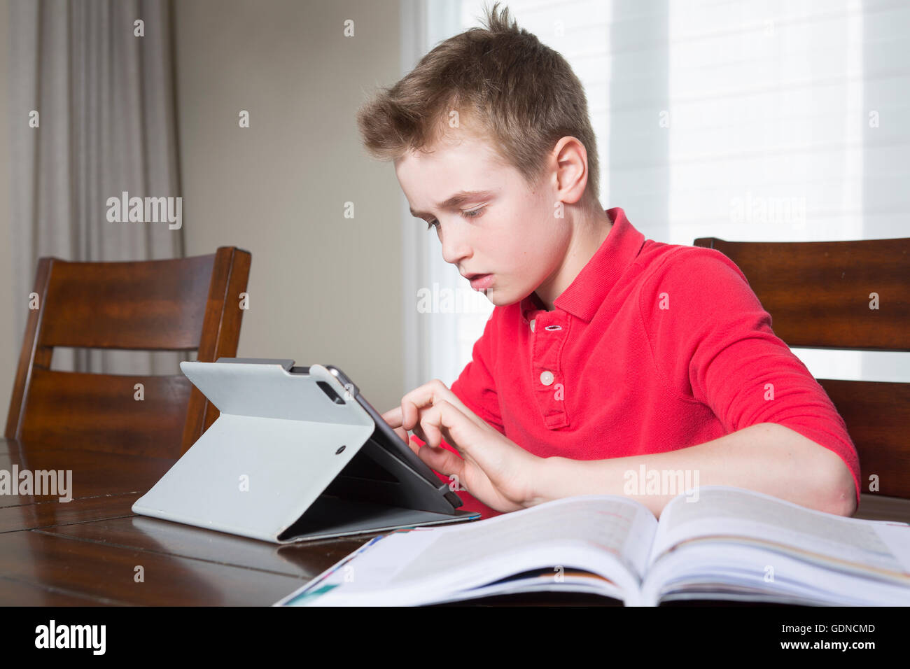 boy doing his homework at home Stock Photo - Alamy