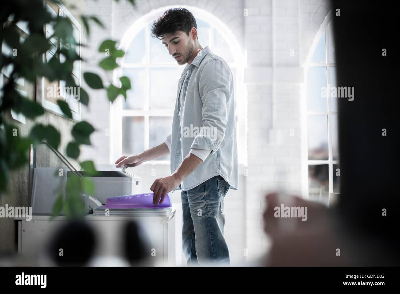 Office worker using fax machine hi-res stock photography and images - Alamy