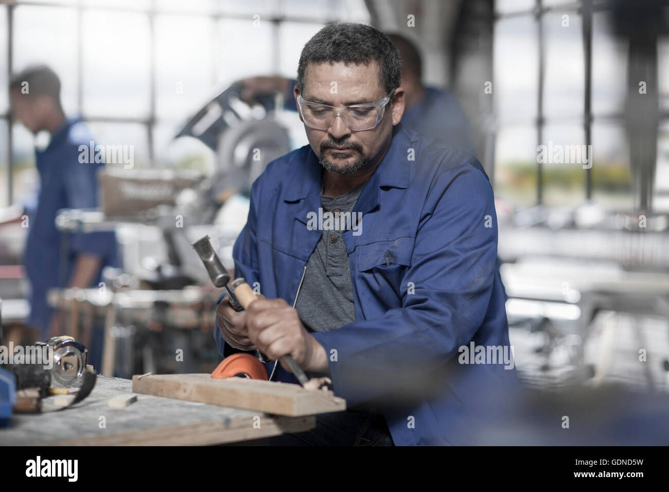 Male using wood chisel hi-res stock photography and images - Alamy