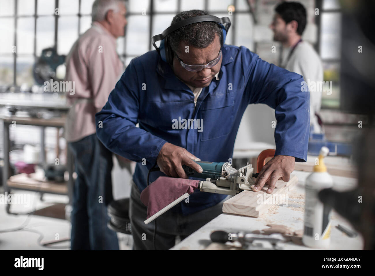 Carpenter using sander hi-res stock photography and images - Alamy