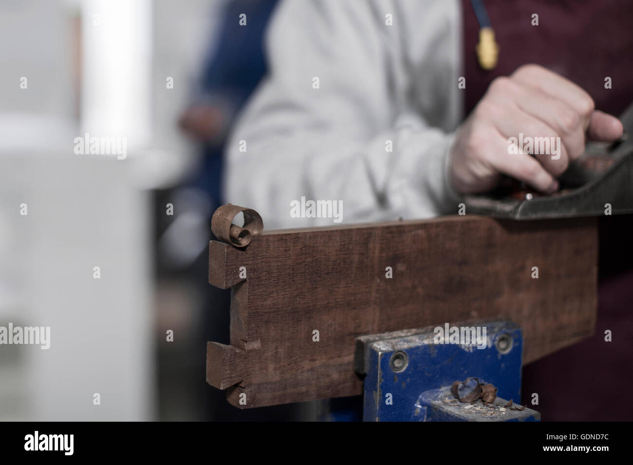 Close up of carpenter's hand using planer in wood workshop Stock Photo ...