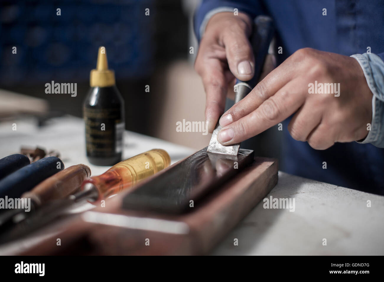 Male using wood chisel hi-res stock photography and images - Alamy