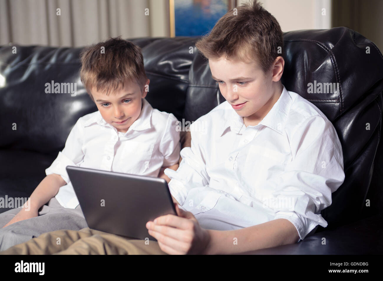 Children playing with tablet pc Stock Photo - Alamy