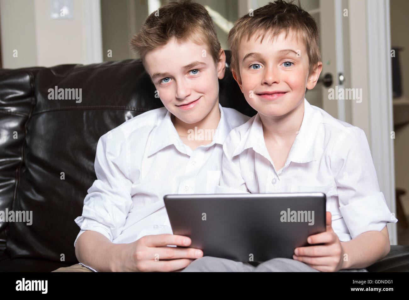 Children playing with tablet pc Stock Photo - Alamy