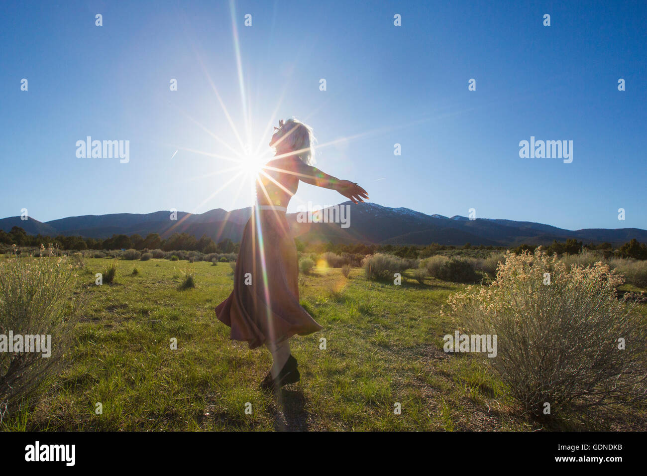Woman dancing open arms hi-res stock photography and images - Alamy