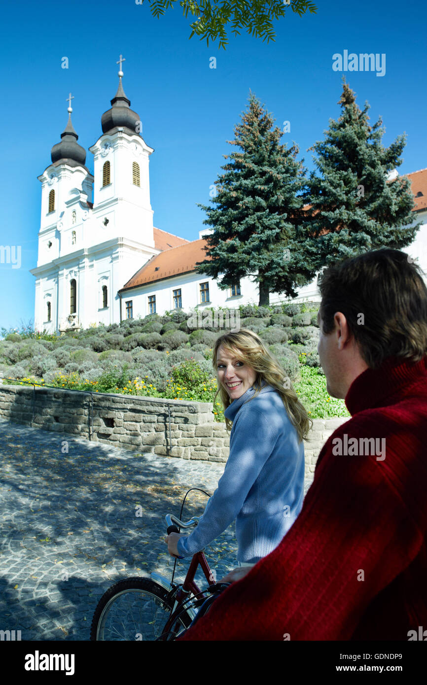 Cycling couple by Benedictine Abbey, Tihany, Lake Balaton, Budapest ...