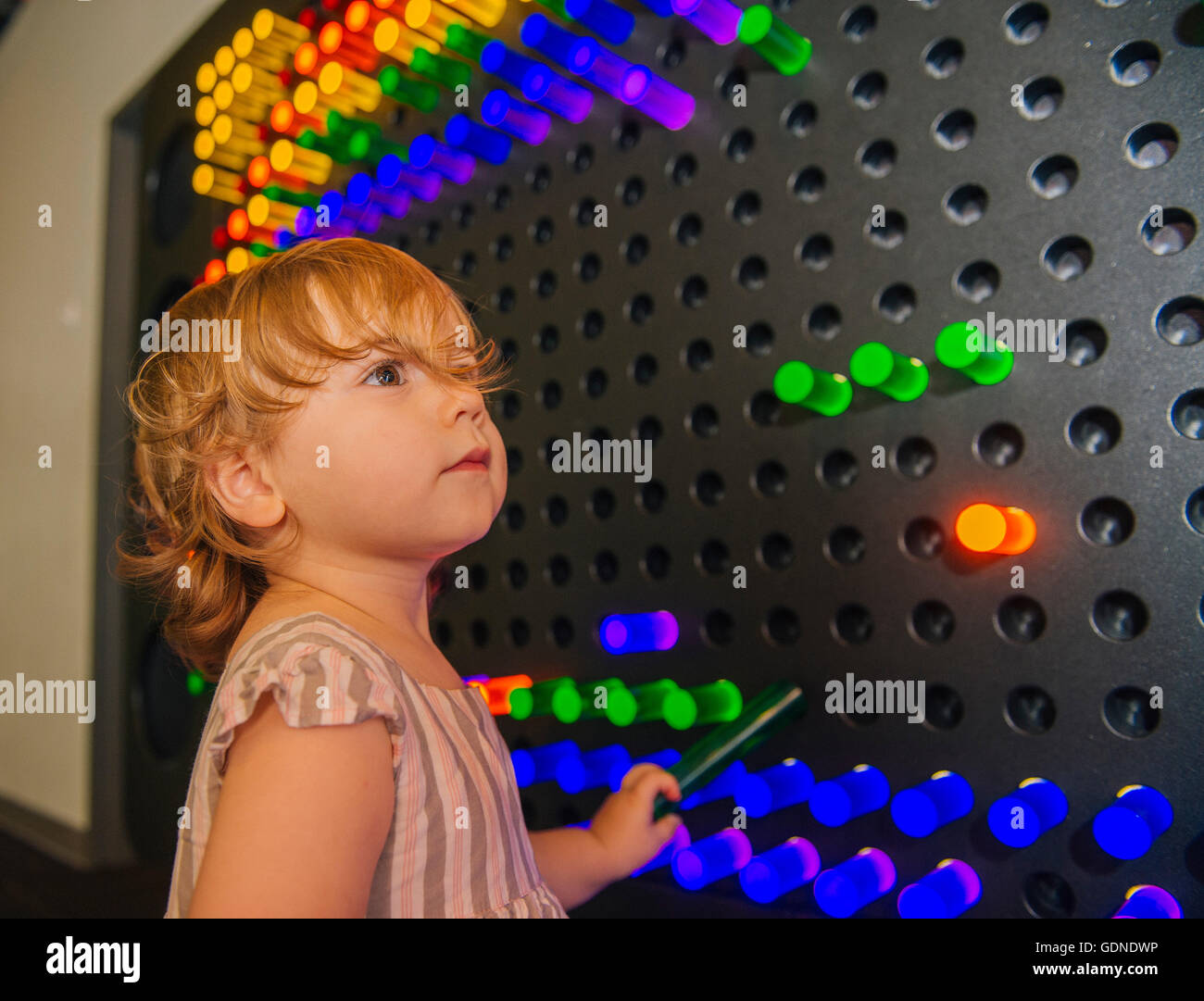 Female toddler mesmerized by colorful illuminated panel Stock Photo - Alamy