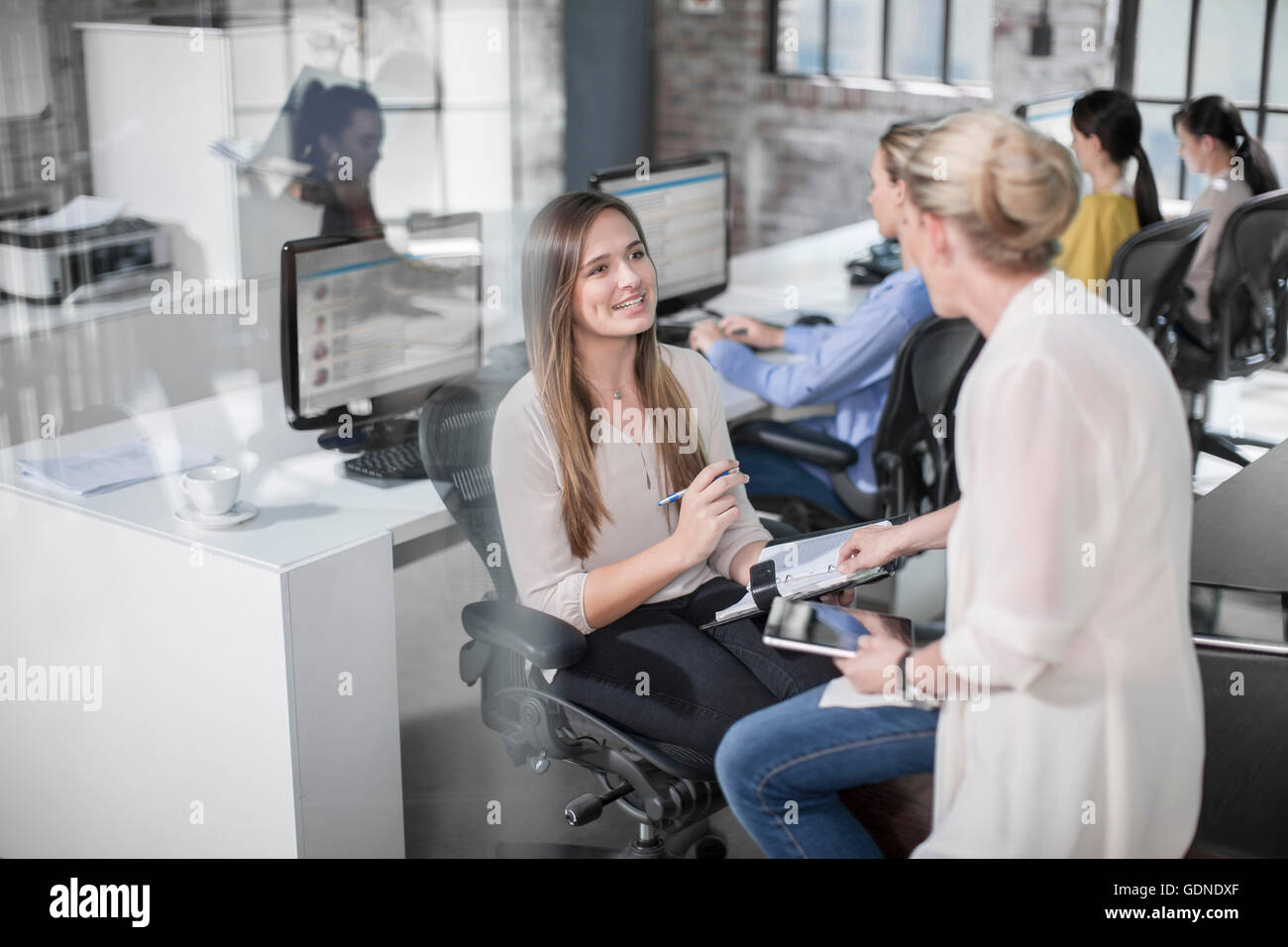 Female manager meeting trainee teenage girl in office Stock Photo - Alamy
