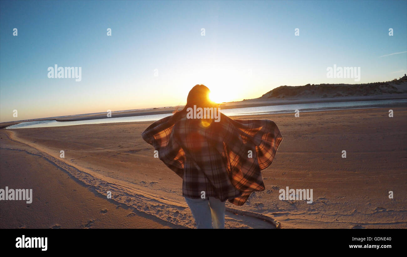 Rear view of woman with wind blowing hi-res stock photography and ...