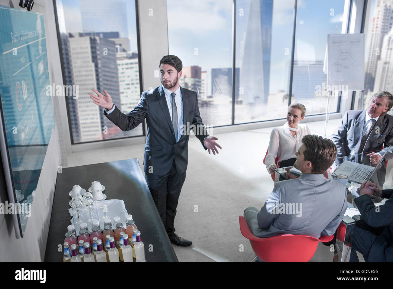 Businessman pointing at screen at presentation, New York, USA Stock ...