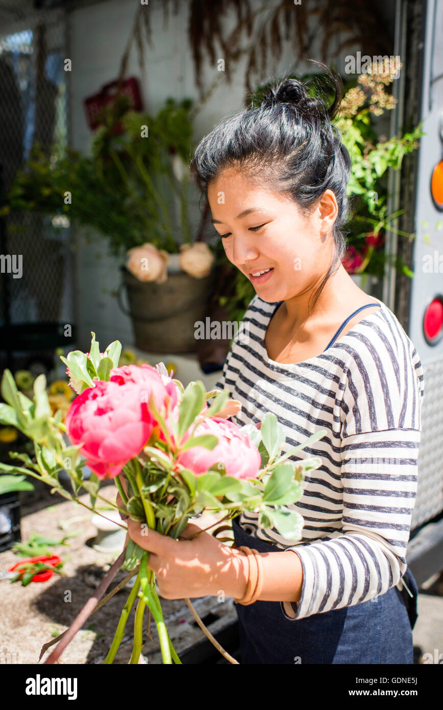 Hand and flowers hi-res stock photography and images - Alamy